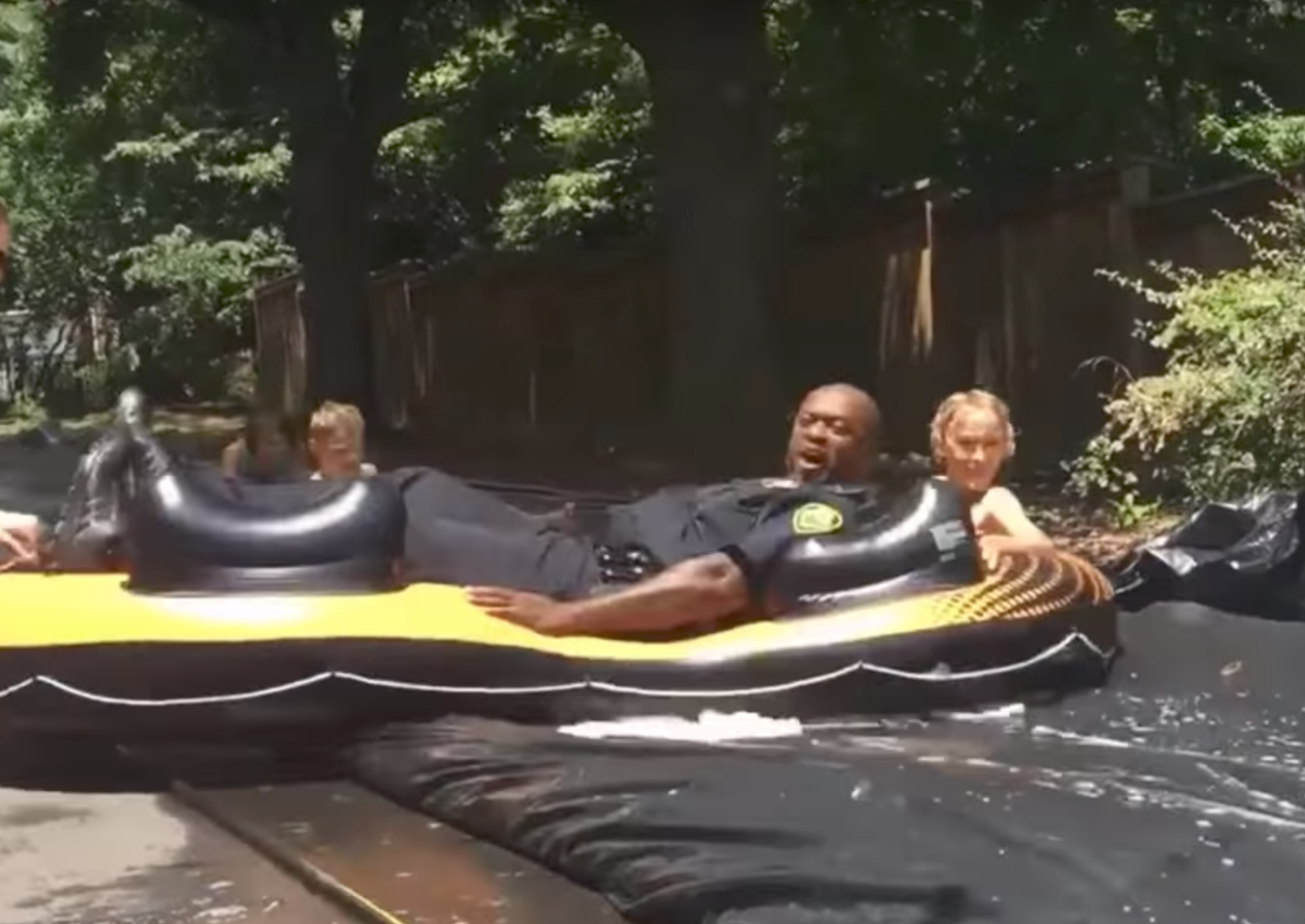 Neighbors Complain About Slip-N-Slide, Cop Joins in the Fun